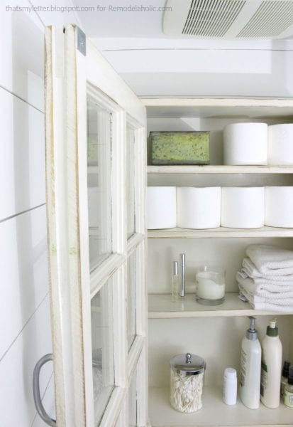 Bathroom Storage Cabinet using an old Window | Remodelaholic