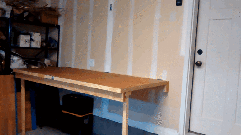 Easy DIY Wall Mounted Folding Table Workbench from a Door | Remodelaholic